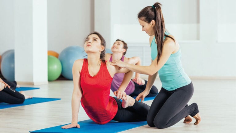 A helping hand - yoga mentor | Om Yoga Magazine